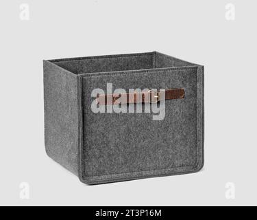 Gray felt storage organizer box with leather handles and buckles Stock ...