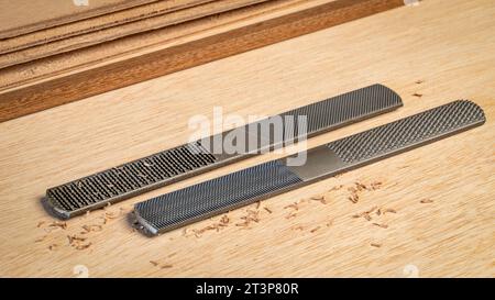 wood rasp files against okoume plywood - woodworking concept Stock ...