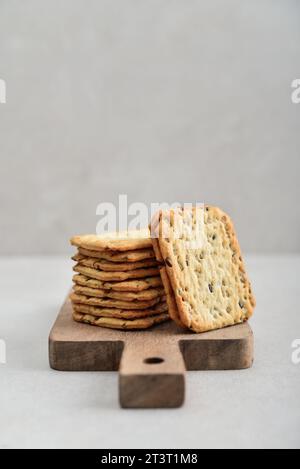 Multigrain crunchy cookies with flax and sesame seeds on wooden cutting ...