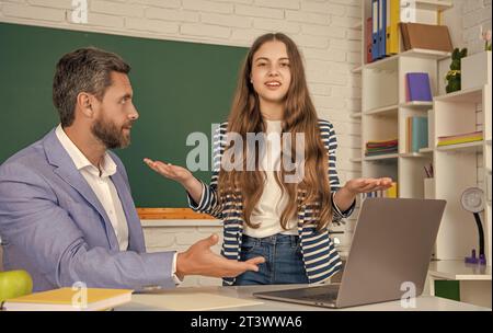 failed child with man teacher in classroom. education Stock Photo - Alamy
