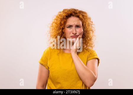 Ginger woman is having toothache Stock Photo - Alamy