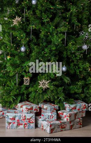 Beautiful gift boxes under Christmas tree in the room, close up Stock ...