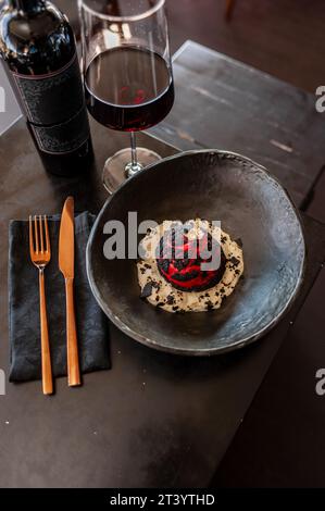 Choux bun with beef, cream cheese, espuma parmesan and Borodino chips ...
