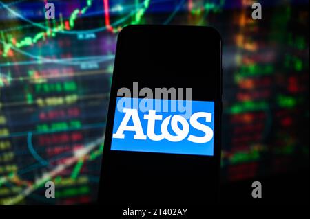 In this photo illustration, an Atos logo is displayed on a smartphone ...