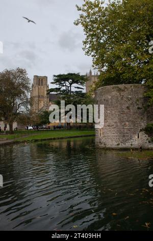 The boundary wall and moat of the historic Bishops Palace in the city ...