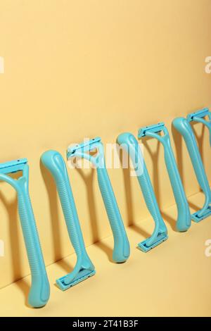 Disposable razors on yellow background, studio shot Stock Photo - Alamy