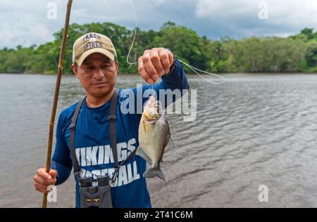 Amazon rainforest: Piranha fishing in the Amazon River near Manaus ...