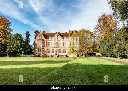 A side view of Shaw House across a green lawn in Newbury, Berkshire. An ...