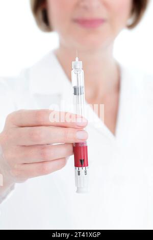 Doctor with autoinjector Stock Photo - Alamy