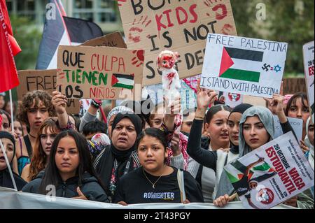 Protesters hold signs and banners at a Stop Adani Mine rally on the ...