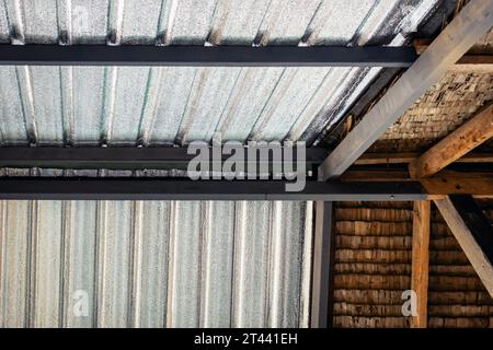Ceiling covered with insulation combined with thatched roof. Aluminum ...