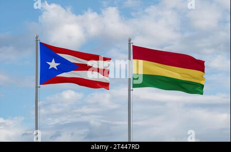Puerto Rico and Bolivia flags waving together in the wind on blue ...