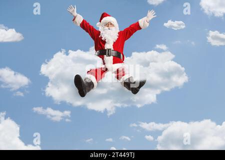 Santa claus floating on clouds up in the sky Stock Photo - Alamy