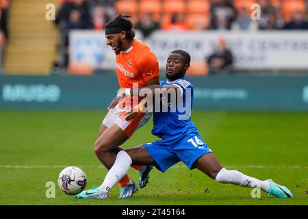 David Ajiboye #16 of Peterborough United competes with Dominic Thompson ...