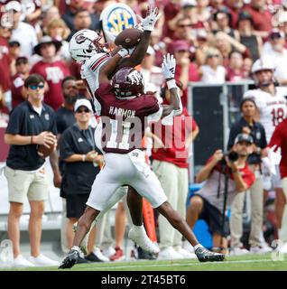 South Carolina wide receiver Xavier Legette (17) makes as catch as Georgia defensive back David ...