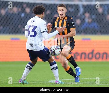 Greg Docherty #8 of Hull City gets away fromDominic Ball #12 of Queens ...