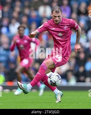 Josh Tymon of Swansea City under pressure from Victor Torp of Coventry ...