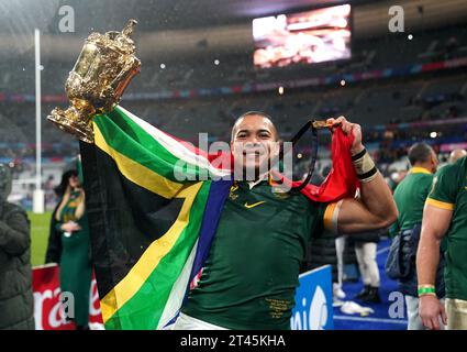 South Africa's Cheslin Kolbe celebrates with the Webb Ellis Cup ...