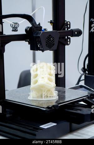 Prototype of car engine printed on 3D printer from molten white plastic ...