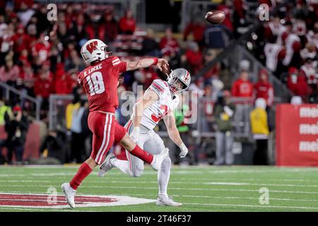 Wisconsin Badgers quarterback Braedyn Locke (18) looks for a receiver ...