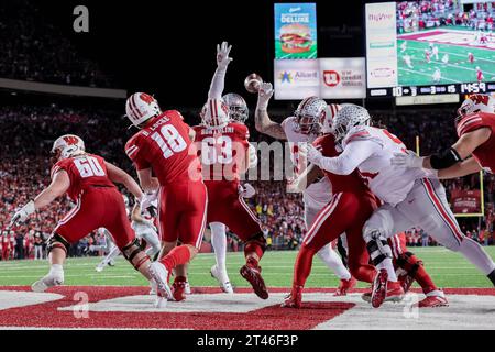 Wisconsin Badgers quarterback Braedyn Locke (18) looks for a receiver ...