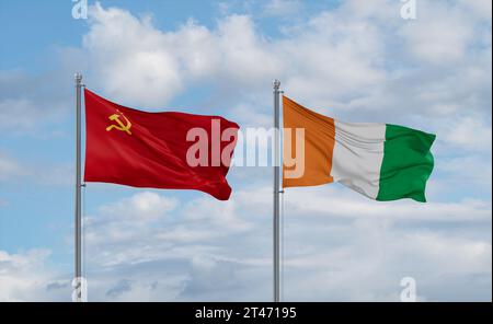 Soviet Union or USSR and Ivory Coast flags waving together in the wind ...