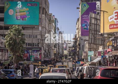 The street, traffic, buildings, and Palestinian people in the downtown ...
