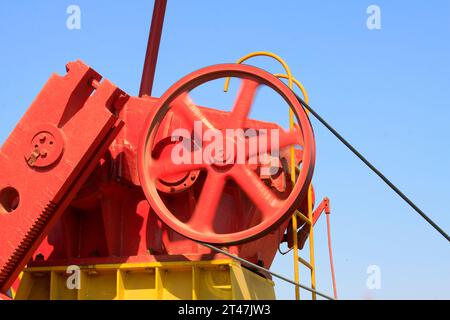 Beam pumping unit rotating wheels, closeup of photo Stock Photo - Alamy