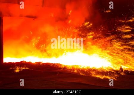 A red-hot factory incandescent light bulb with glowing filaments inside ...