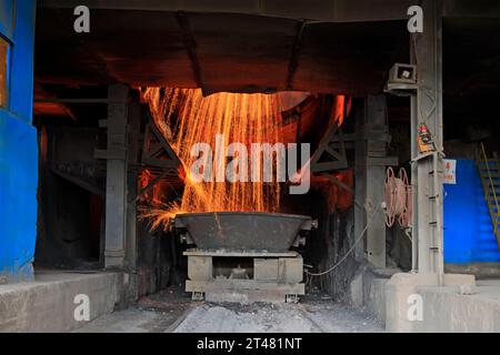 steelmaking converter dumping steel slag in a factory, closeup of photo ...