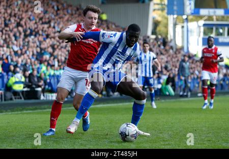 Rotherham United's Ollie Rathbone battles for the ball with Sheffield ...