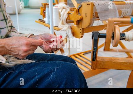 Spinning hemp with a traditional loom Stock Photo - Alamy