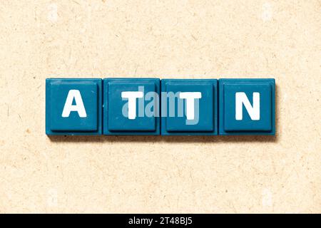Alphabet letter in word ATTN (Abbreviation of attention) on wood ...