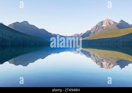 Beautiful Bowman lake with reflection of the spectacular mountains in ...