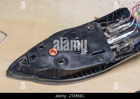 Disassembled electric iron. repairman checking and fixing broken iron ...