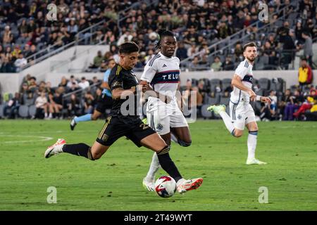 Vancouver Whitecaps defender Sam Adekugbe (3) dribbles past the defense ...
