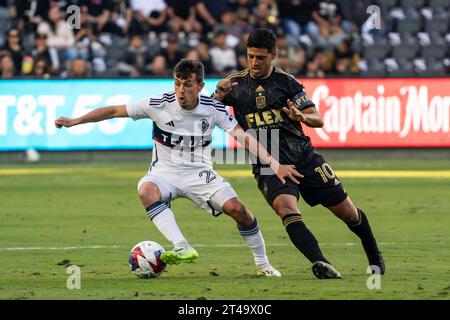 Vancouver Whitecaps' Andres Cubas (20) jumps for the ball against the San Jose Earthquakes ...