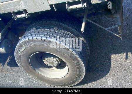 Overloaded truck wheels, closeup of photo Stock Photo - Alamy