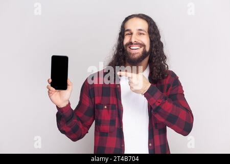 Happy Arab Man Shows Blank Laptop Screen for Mockup in Neon Light ...