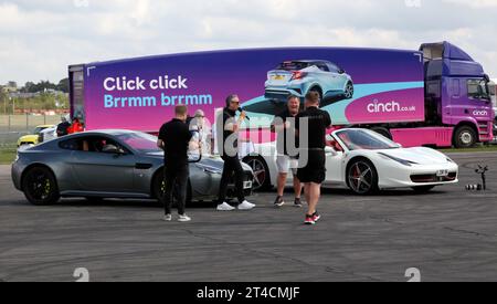 Mike Brewer and David Trigg, showcasing a selection of supercars, in a ...