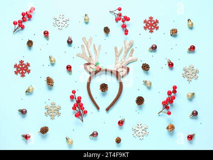 Beautiful Christmas headband and confetti on light background with ...