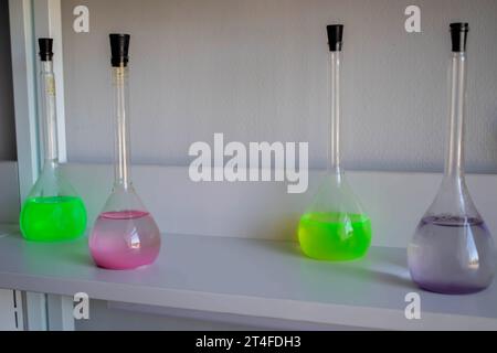 A closeup of colorful liquid chemical elements and a SARS blood test on ...
