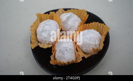moci or mochi is a food made from sticky rice flour in a round shape ...
