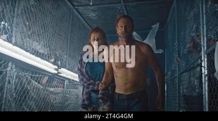 RUMBLE THROUGH THE DARK, from left: Bella Thorne, Aaron Eckhart, 2023. © Lionsgate Home ...