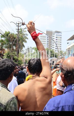 Shoola kaavadi during Navaratri festival in Poojappura Stock Photo - Alamy