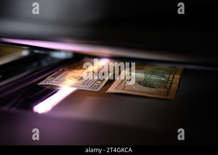 Using a copy machine to print forgery currency Stock Photo - Alamy
