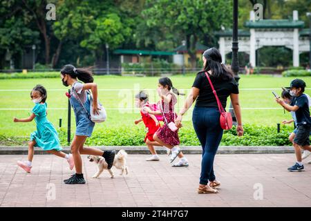 Children at play running through Rizal Park, Ermita, Manila, The ...
