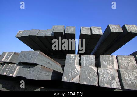 Steel ingot under the blue sky, closeup of photo Stock Photo - Alamy