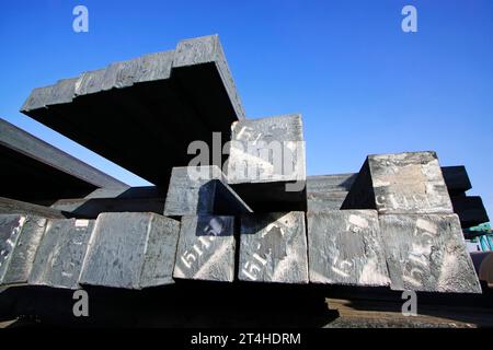 Steel ingot under the blue sky, closeup of photo Stock Photo - Alamy