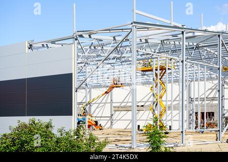 Complex large volume steel frame structure assembly using self ...